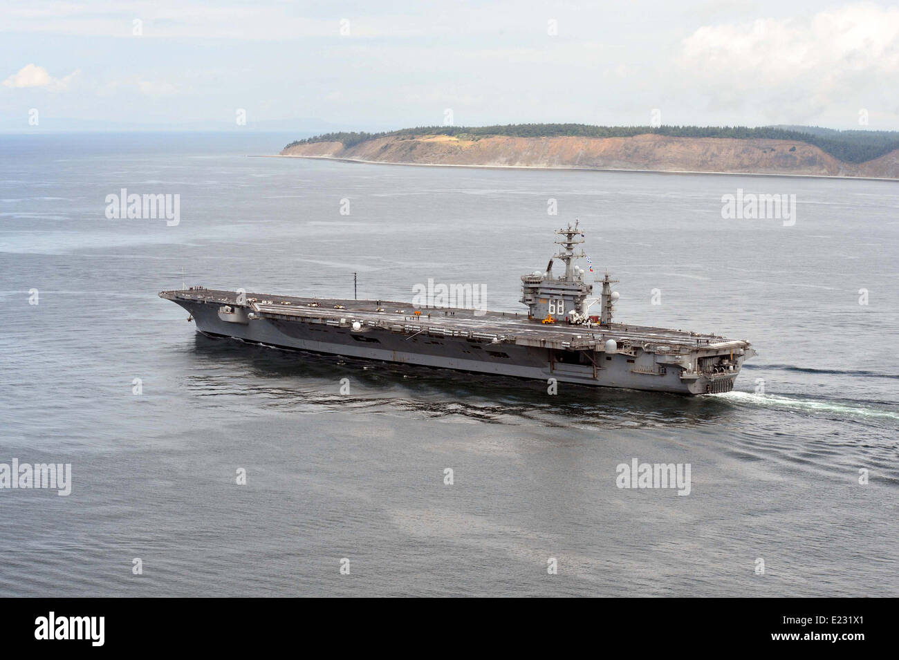 US Navy Nimitz-class aircraft carrier USS Nimitz cruises in the Strait ...
