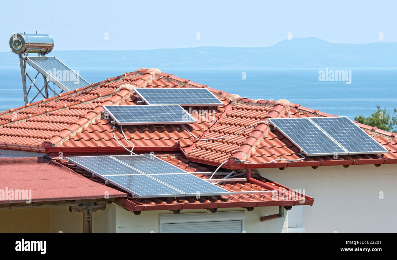 Solar panels on the roof of a house Stock Photo - Alamy