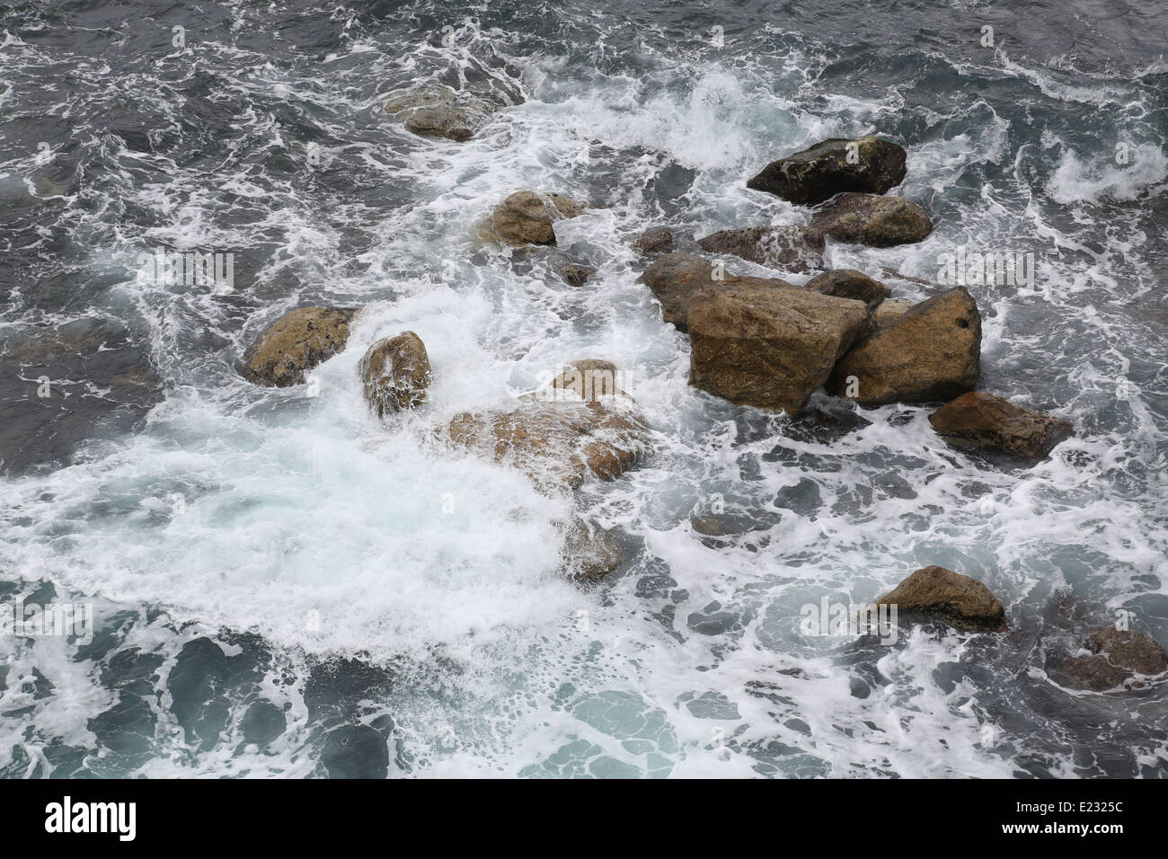 Waves breaking on the rocks Stock Photo - Alamy