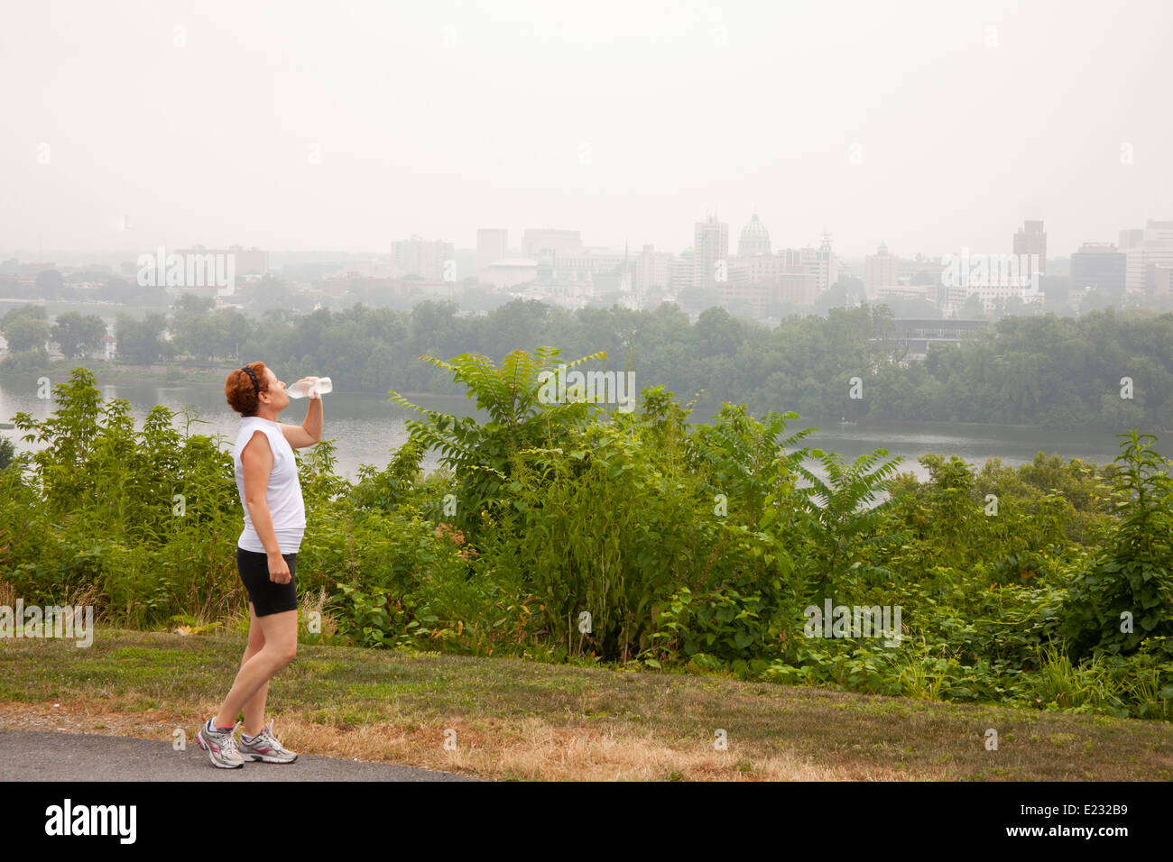 Woman overlooking city river hi-res stock photography and images - Alamy
