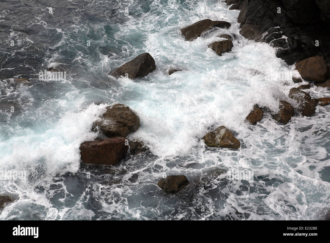 Waves breaking on the rocks Stock Photo - Alamy