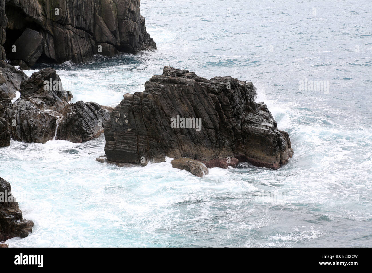 Waves breaking on the rocks Stock Photo - Alamy