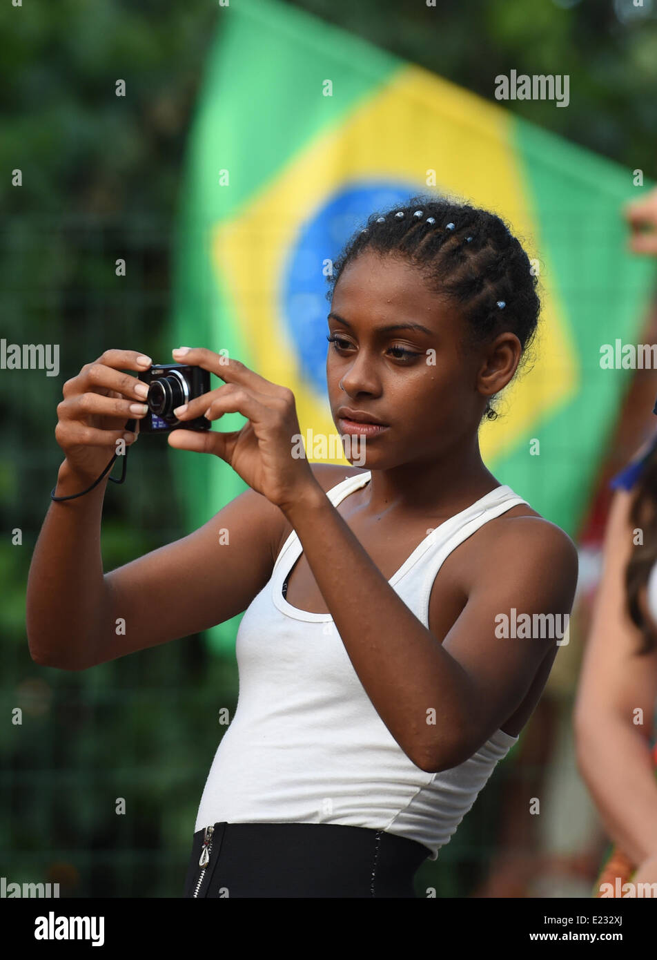 Santo Andre, Brazil. 11th June, 2014. A girl takes a photograph during ...
