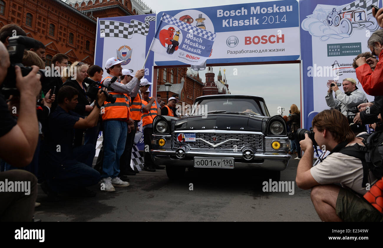 Moscow, Russia. 14th June, 2014. People watch and cheer for the classic ...