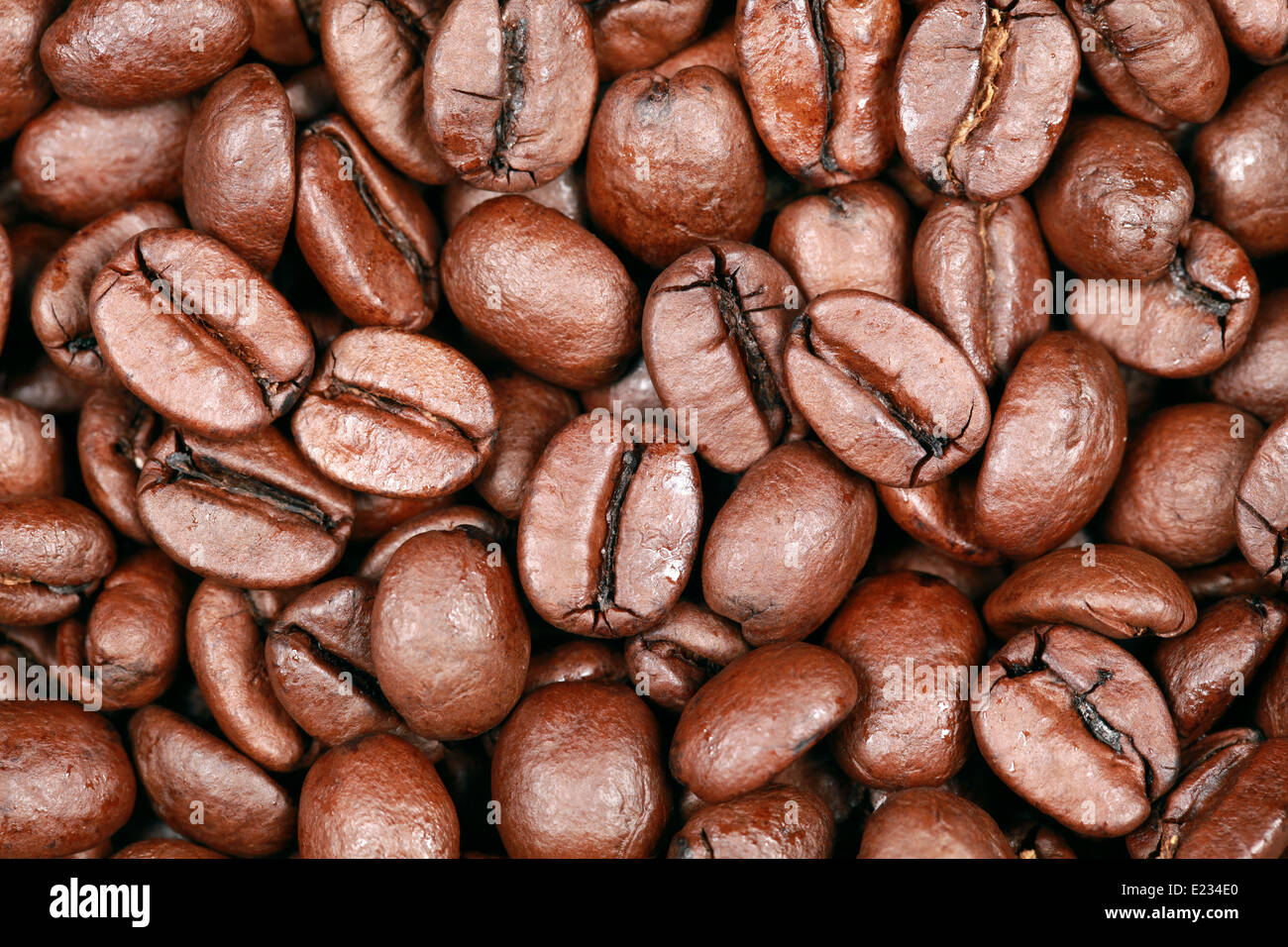 Group of coffee beans forming a background Stock Photo - Alamy