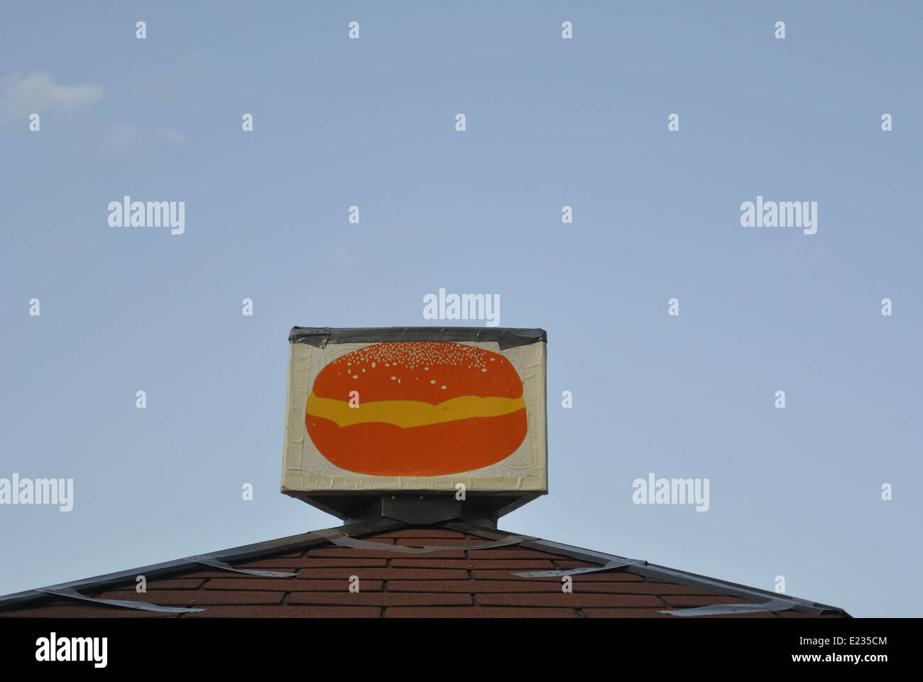 Sign for doughnut shop and clear blue sky Stock Photo - Alamy