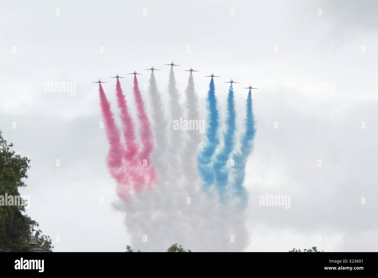 London UK. 14th June 2014. Red Arrows perform a flypast over Buckingham ...