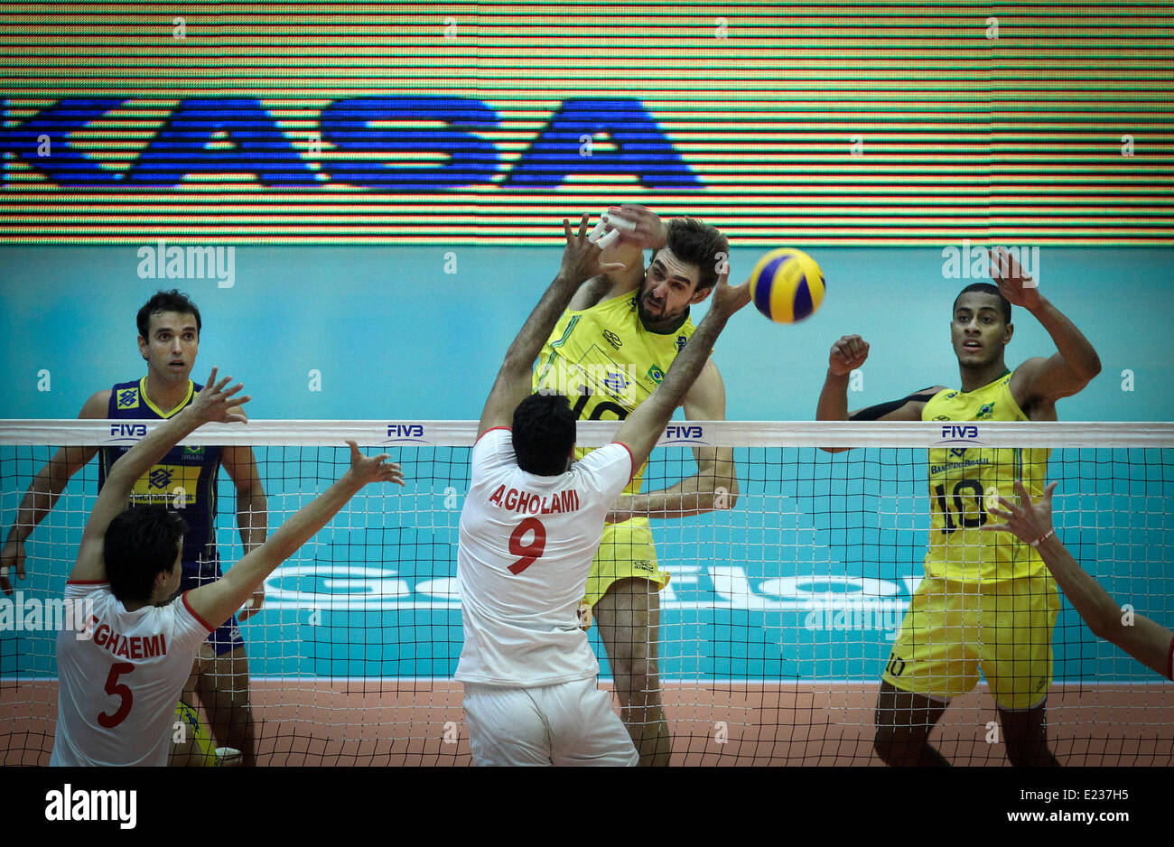 Tehran, Iran. 13th June, 2014. Lucas Satkamp (top) of Brazil spikes the ...