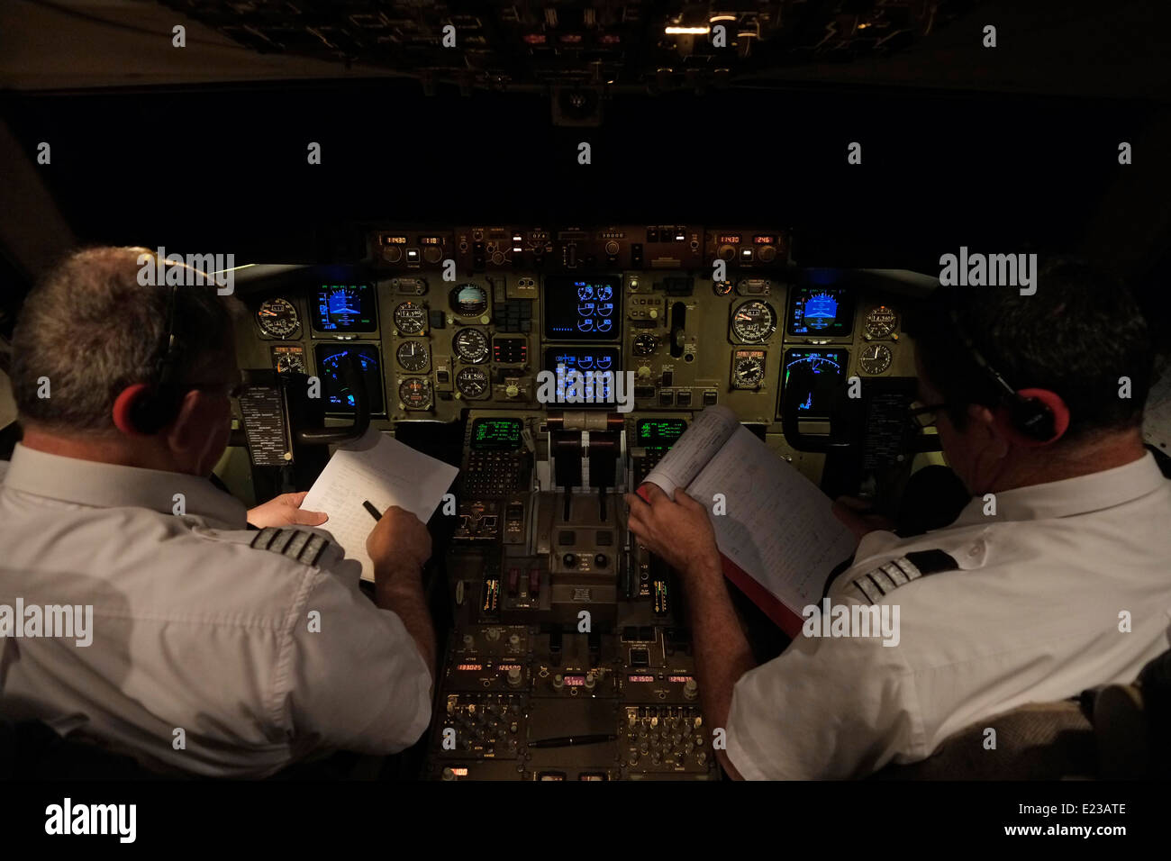 Arkia Israeli airline pilot and first officer reviewing a pre-flight ...