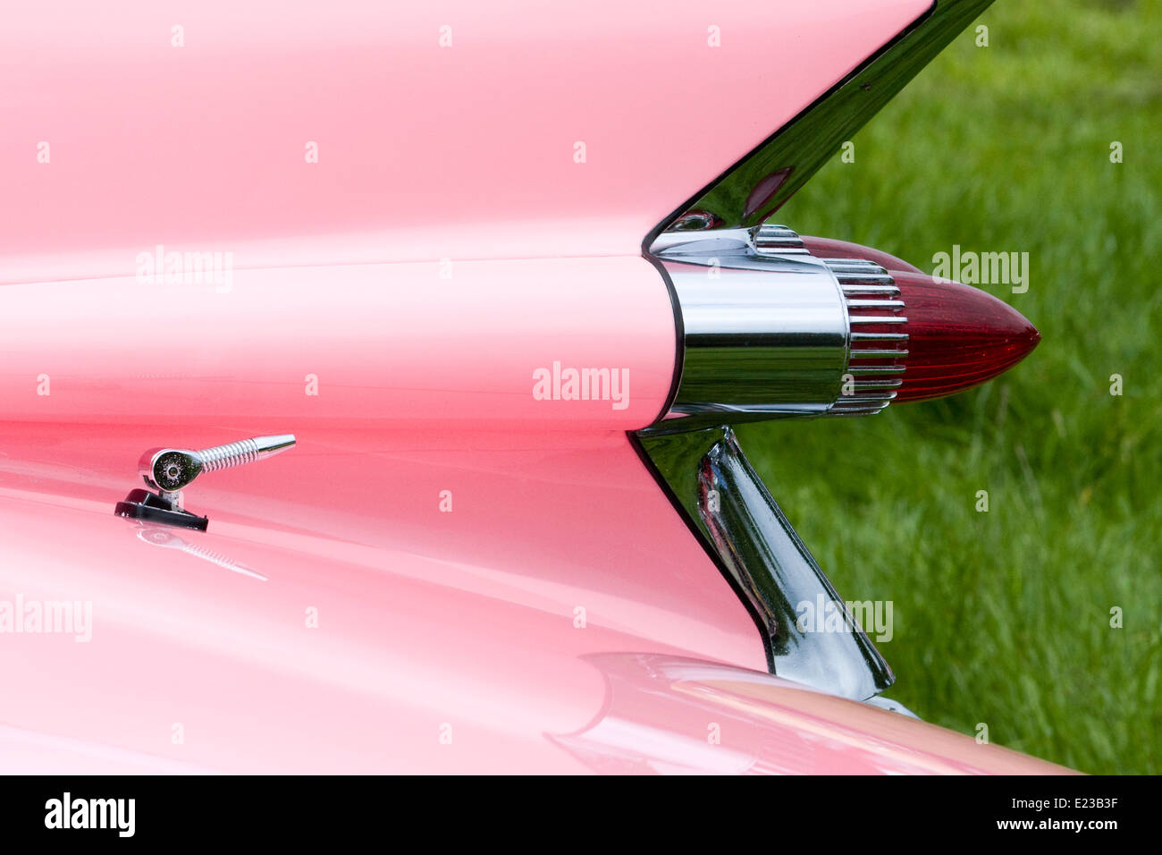 1959 Pink Cadillac. Sharp tail fin with dual bullet tail lights Stock ...