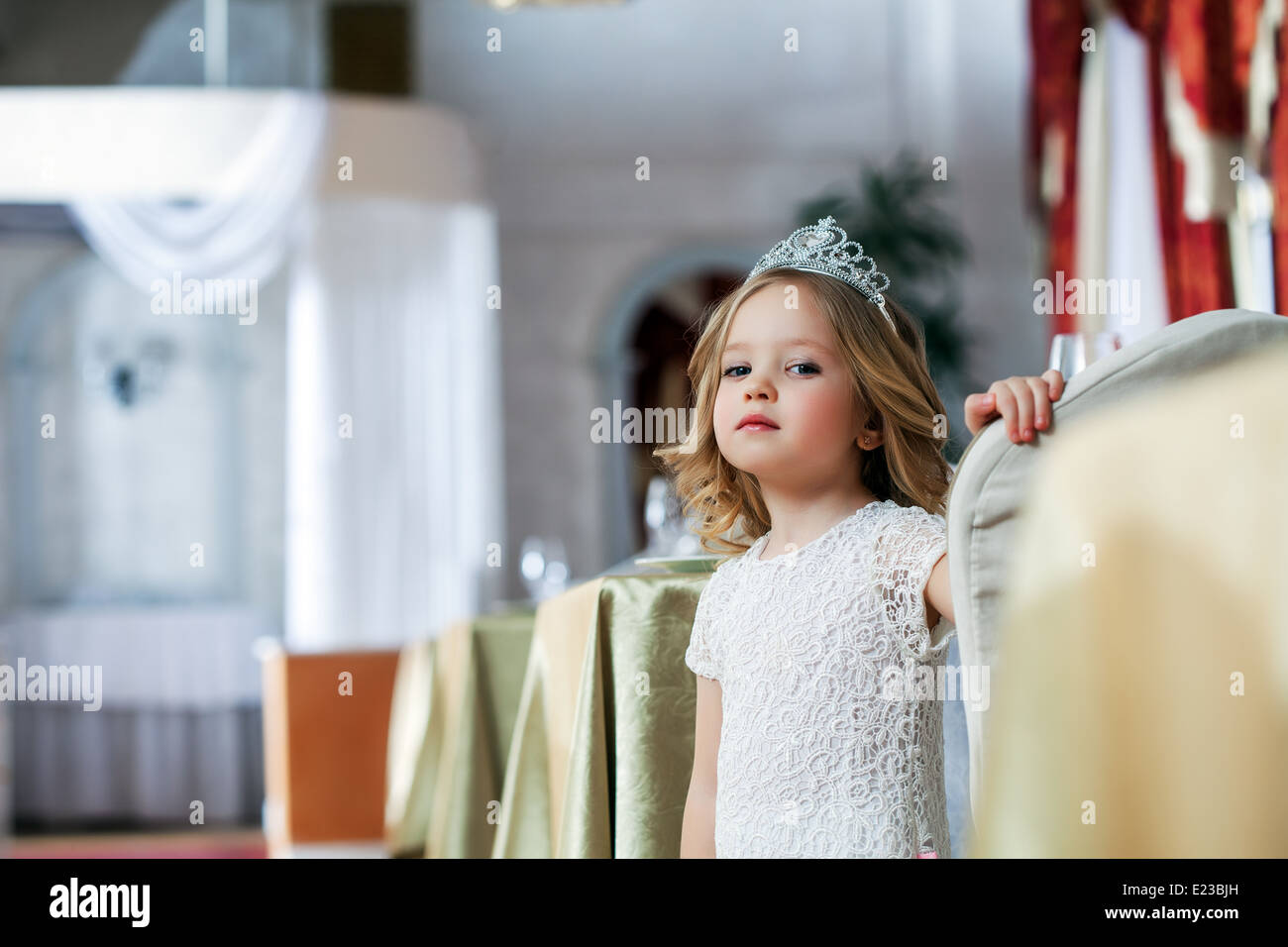 Portrait of smart little girl posing in restaurant Stock Photo - Alamy