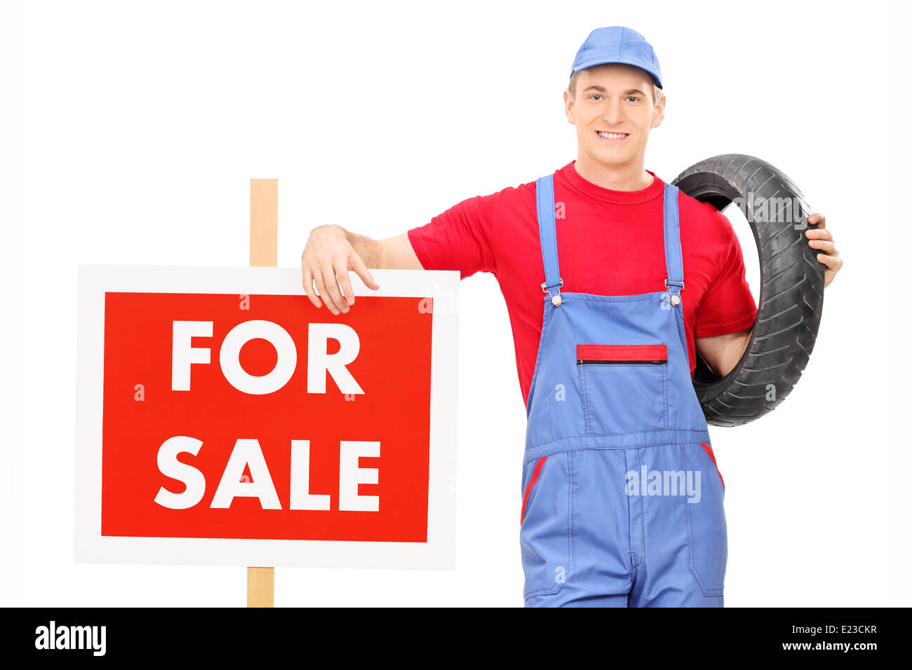 Mechanic holding banner Cut Out Stock Images & Pictures - Alamy