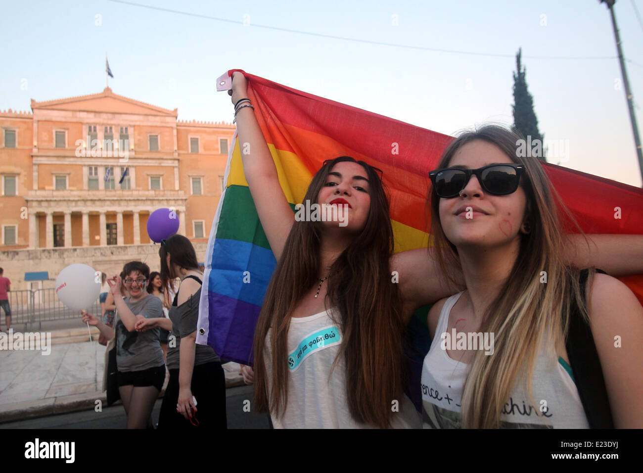 Athens, Greece. 14th June, 2014. Participants wave a rainbow peace flag ...