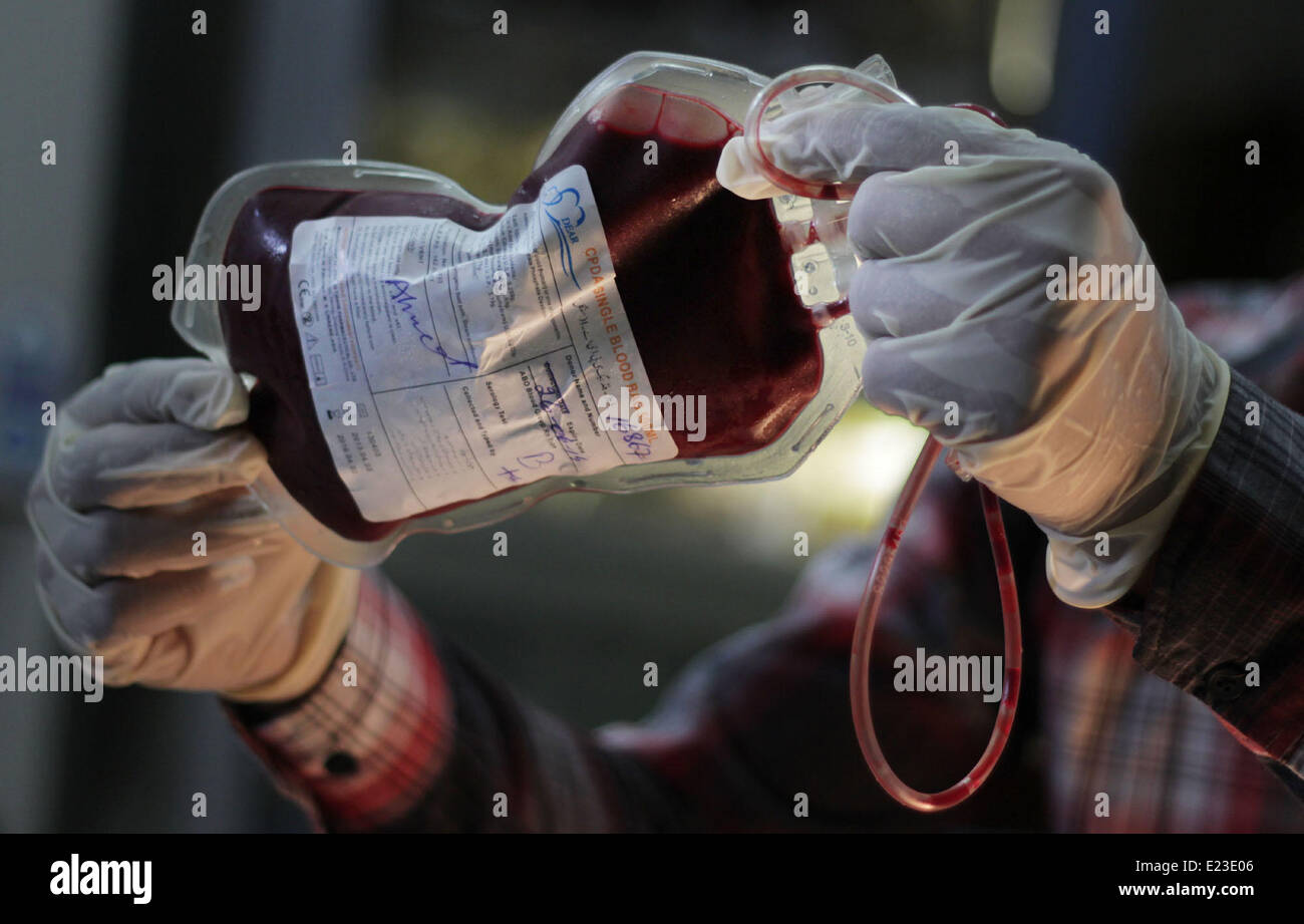 Lahore, Pakistan. 14th June, 2014. Pakistani medical technologist ...