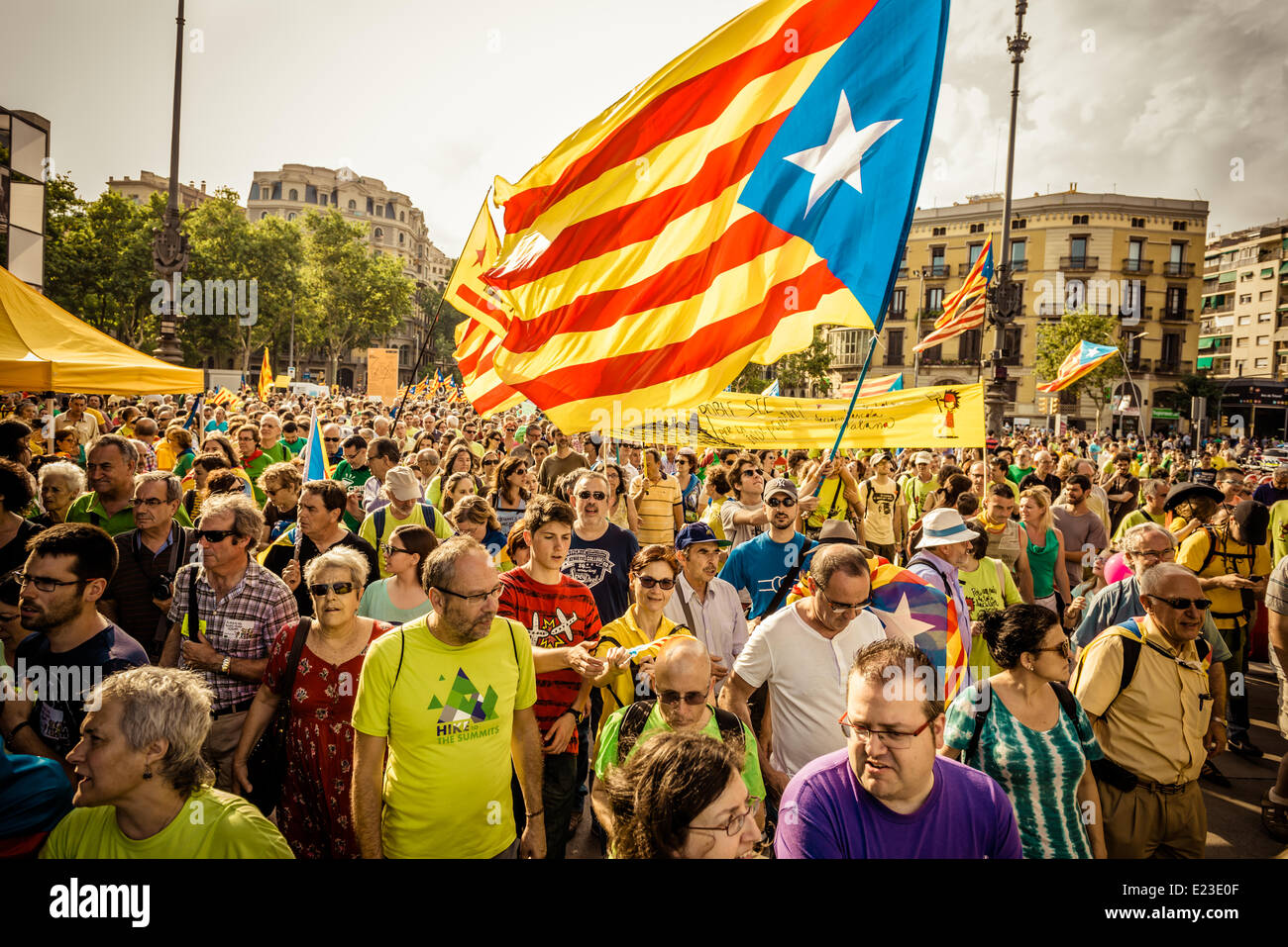 Barcelona, Spain. June 14th, 2014: Demonstrators waving estelada flags ...
