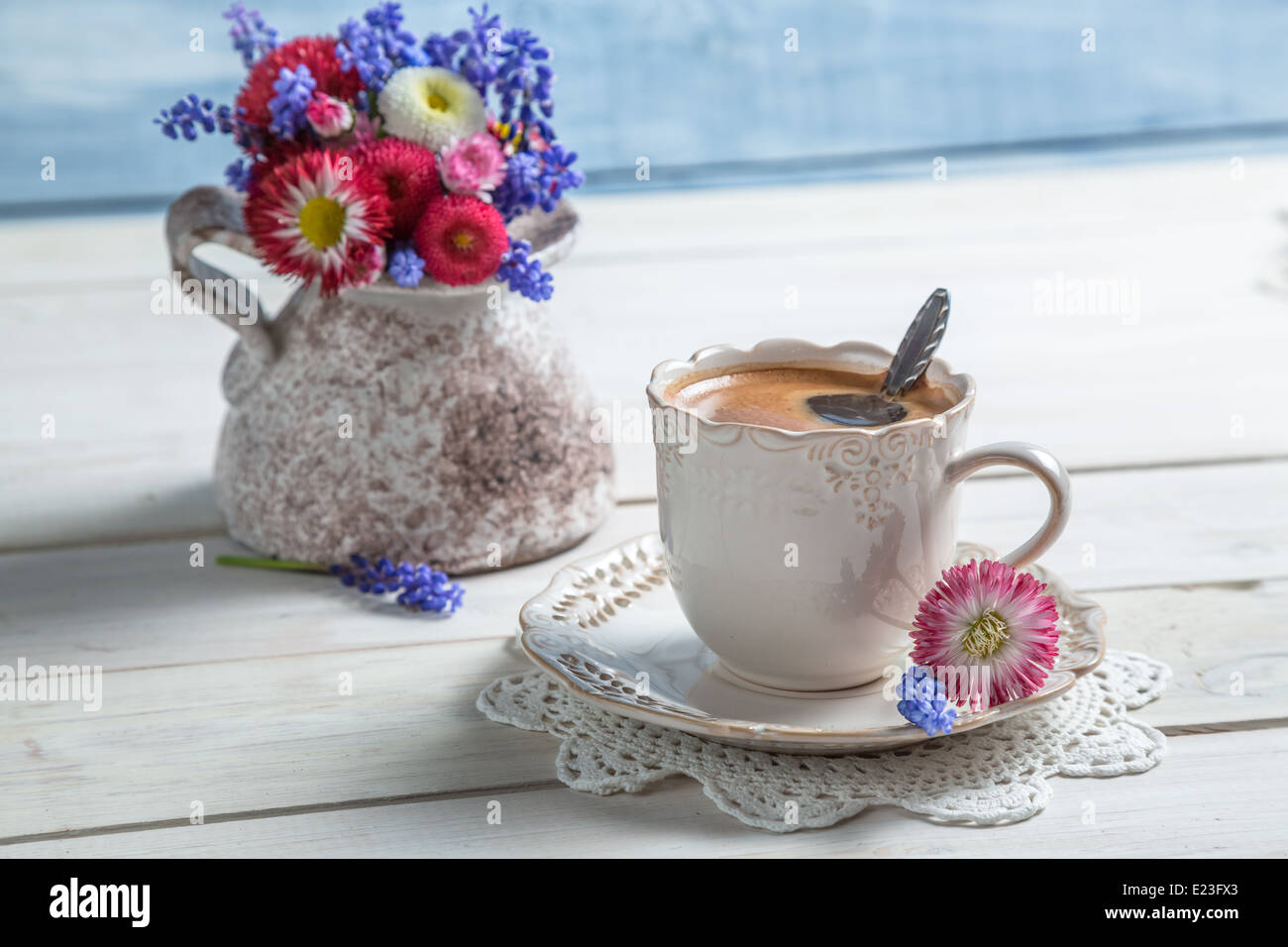 Cup of coffee and spring flowers Stock Photo - Alamy