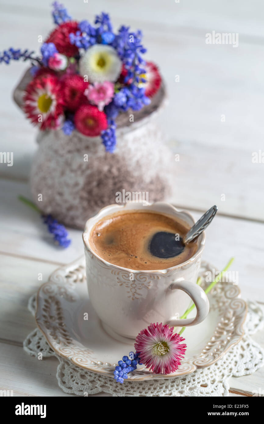 Cup of hot coffee and spring flowers Stock Photo - Alamy