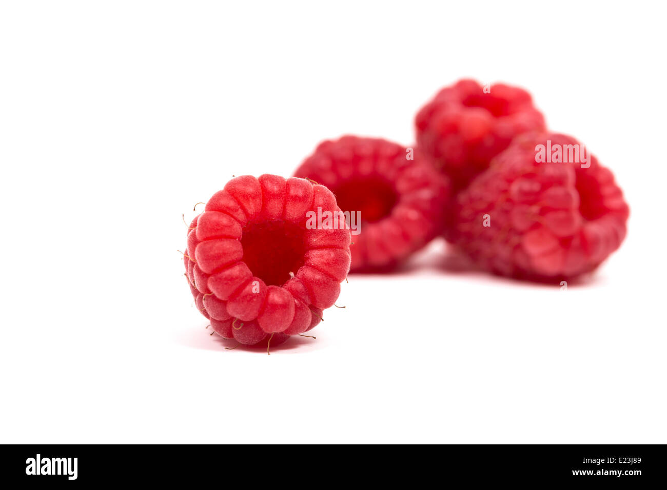 ripe red raspberry isolated on white background Stock Photo - Alamy