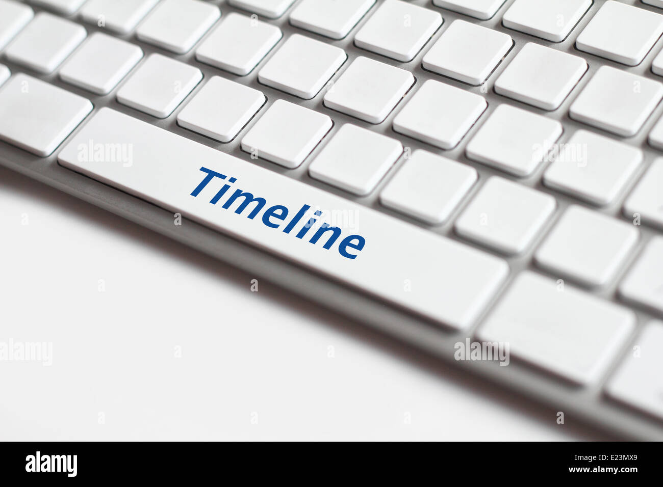 Photo of timeline button on the white keyboard Stock Photo - Alamy