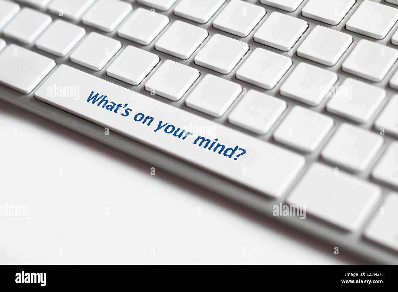 Photo of blue characters on the white keyboard button Stock Photo - Alamy
