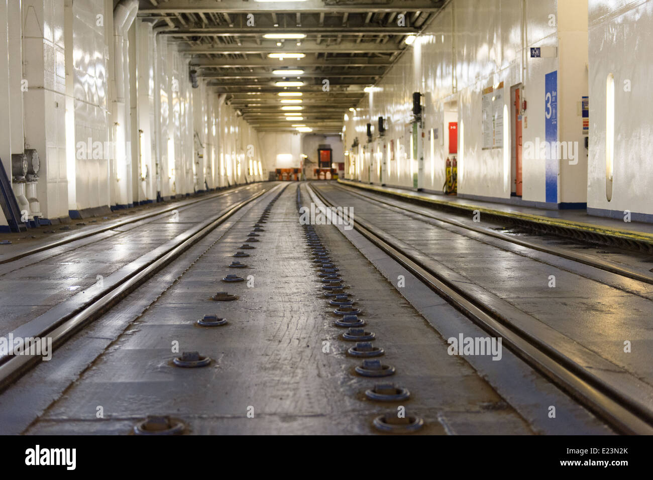 Inside and Roll on / Roll off ship with train tracks, it is the ferry ...