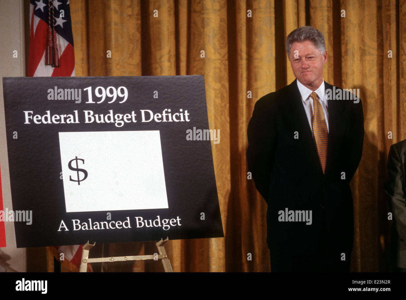 US President Bill Clinton smiles as he unveils the first balanced ...
