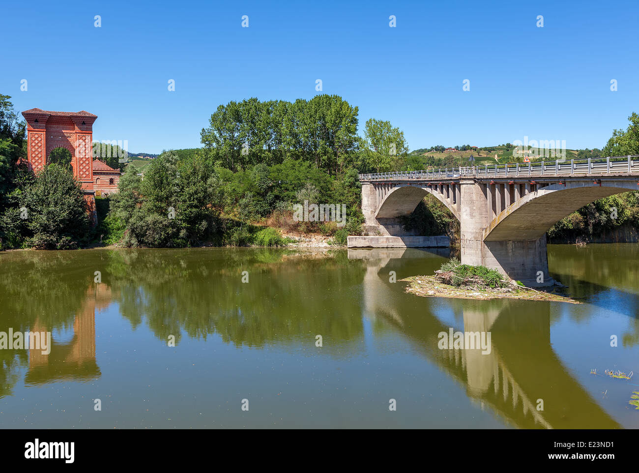Bridge over green water of Tanaro river in Piedmont, Northern Italy ...