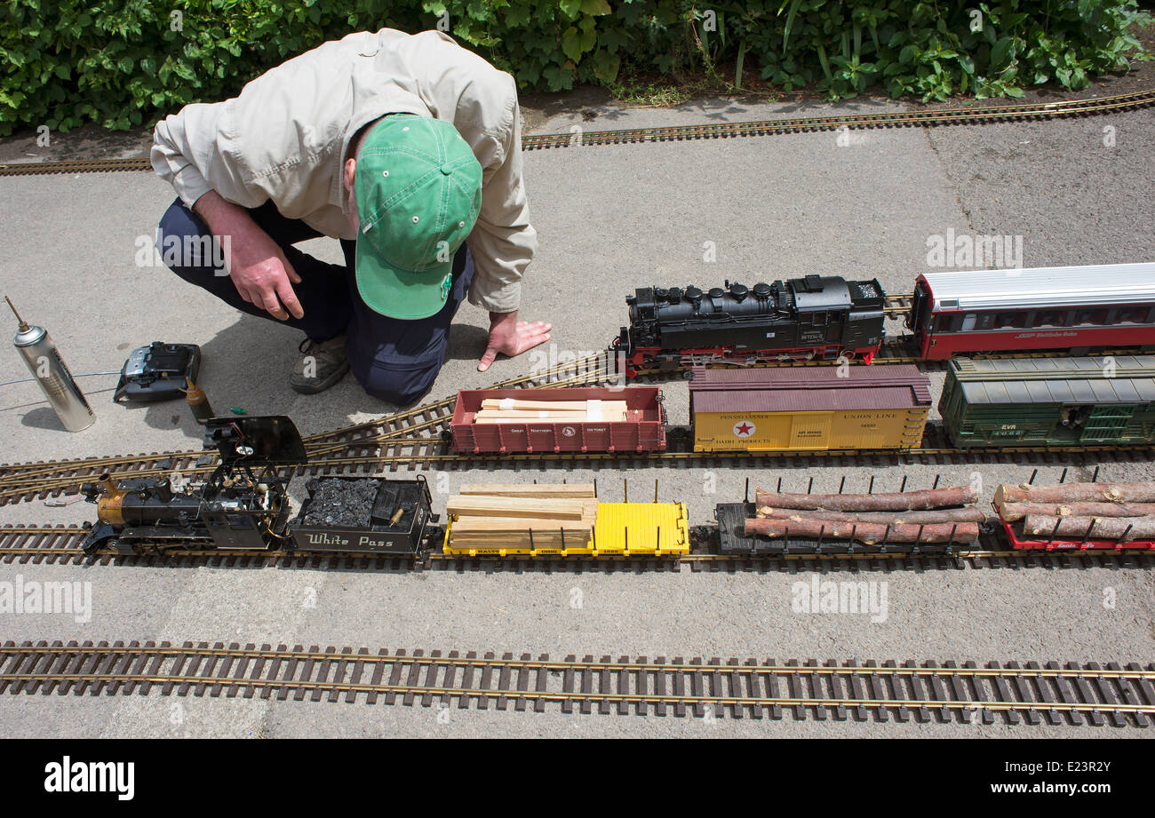 Model railway engineer servicing his locomotives Stock Photo - Alamy