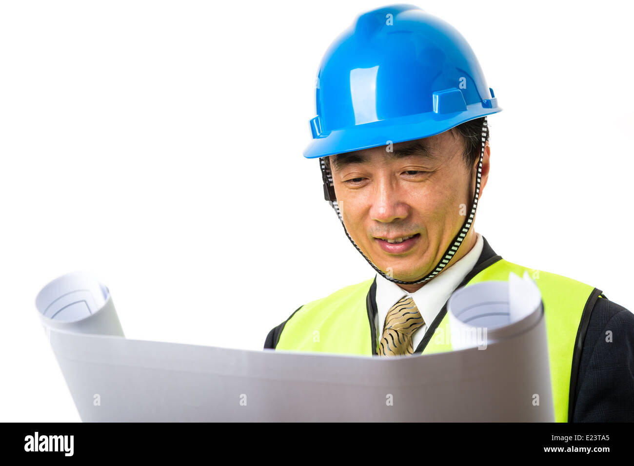 Asian male construction manager with a blueprint Stock Photo - Alamy