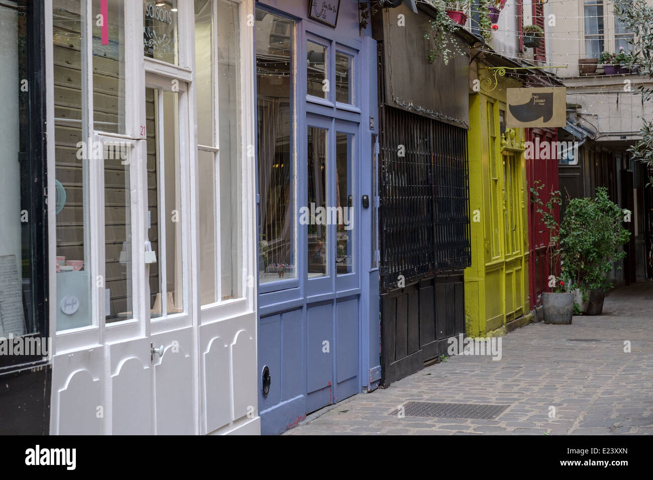 Narrow alley in Paris France with very colorful house front, white ...
