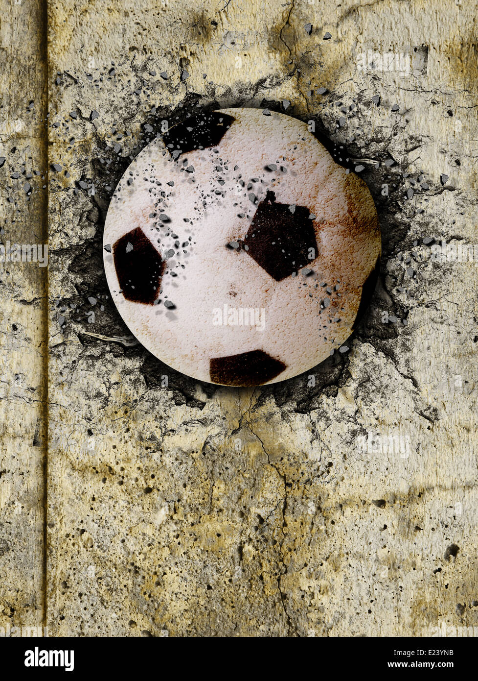 a soccer ball destroy a brick wall Stock Photo - Alamy