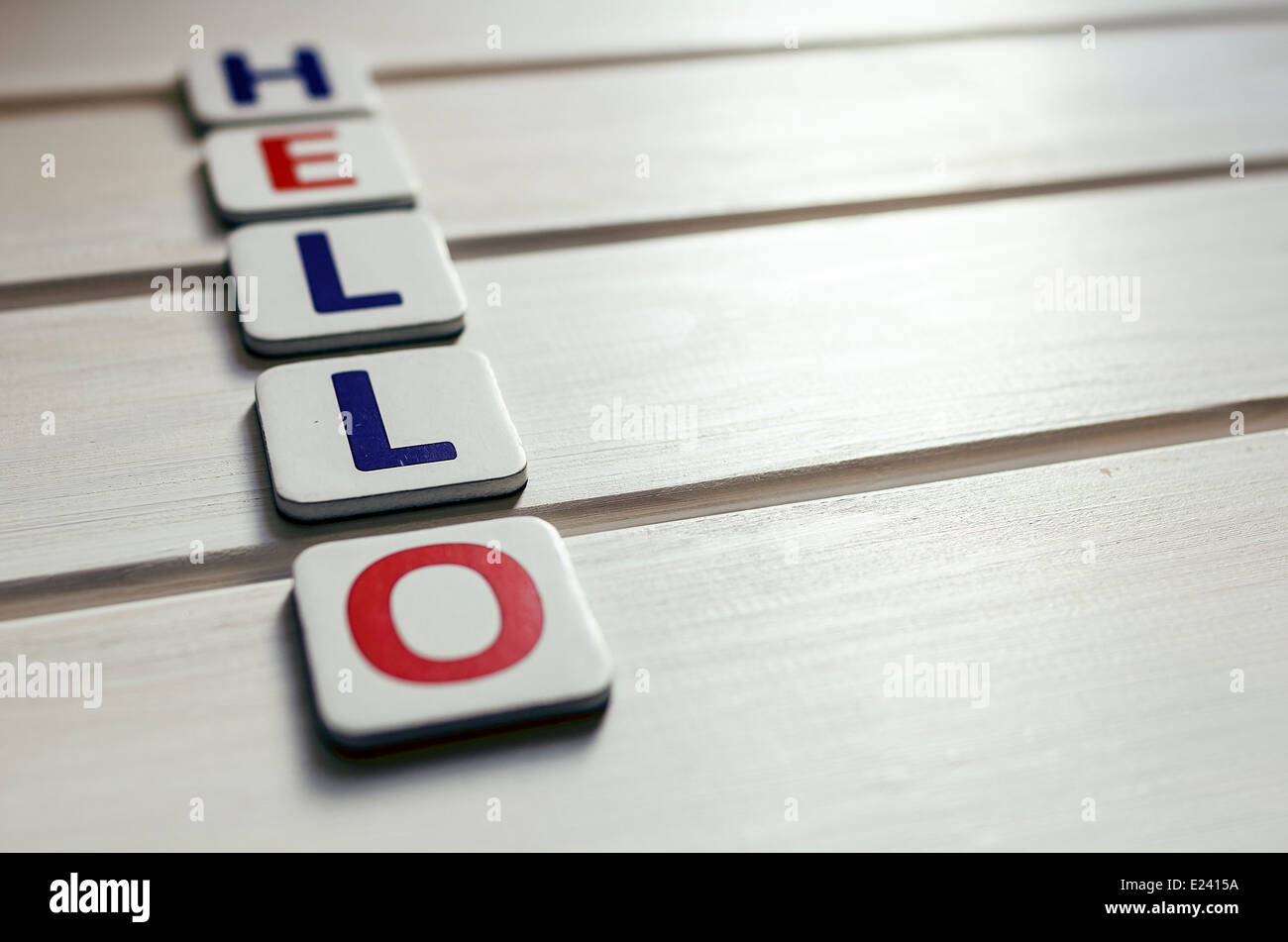 Hello word composed of letters on a background of wood Stock Photo - Alamy