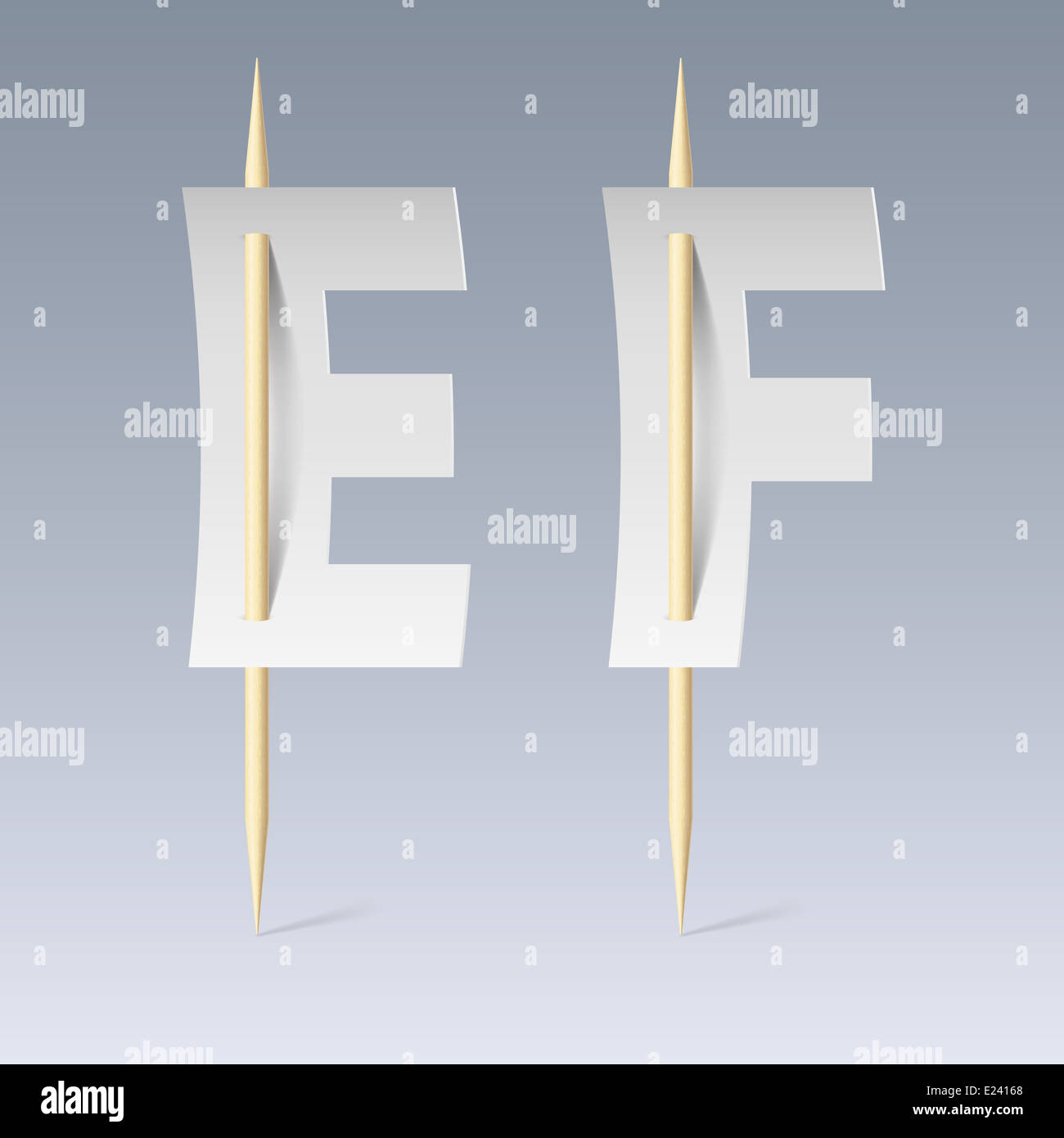 White paper cut font on toothpicks on grey background. E and F letters ...