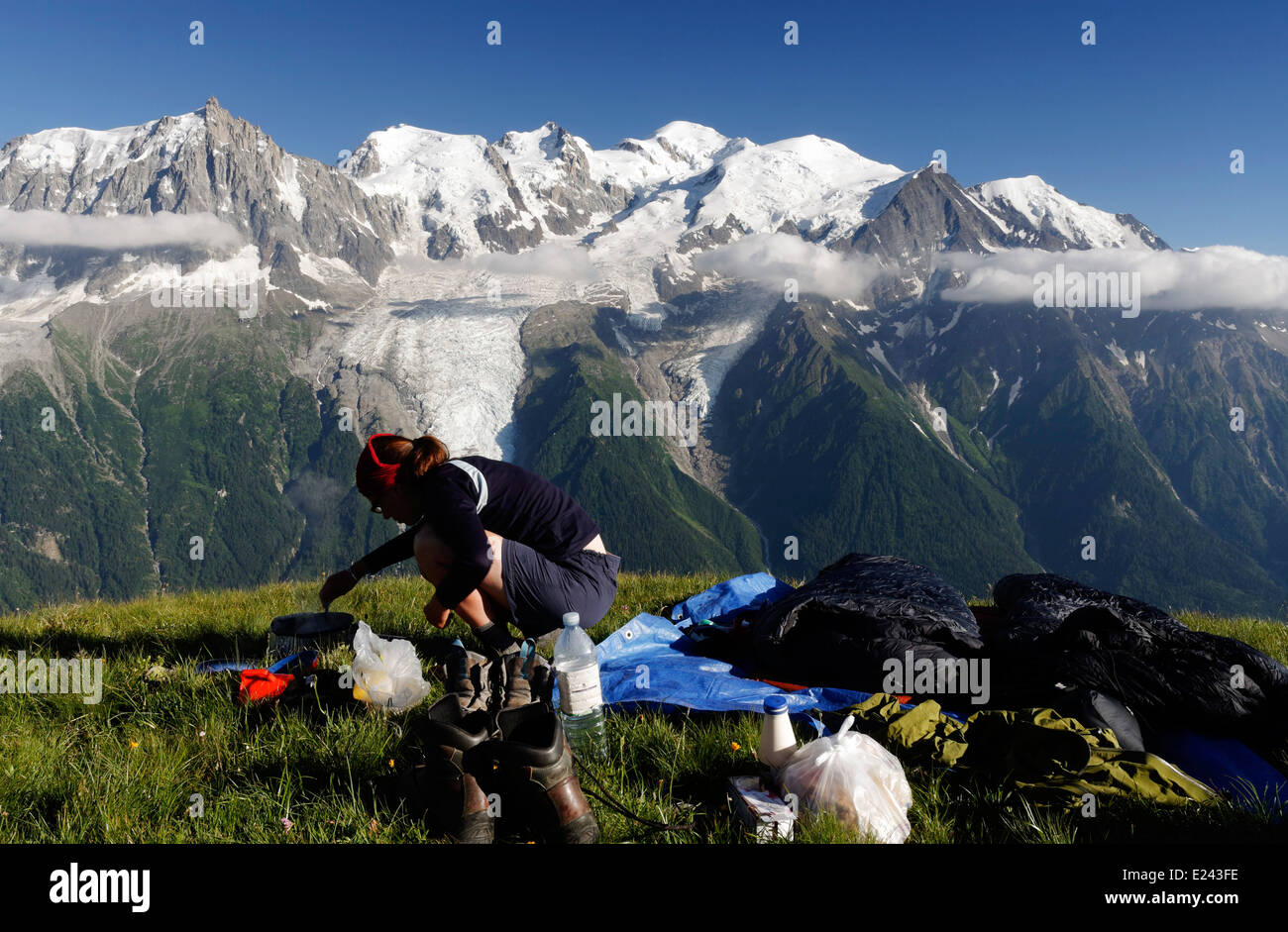 A lady camper preparing food wild camping on le Brevent in the French ...
