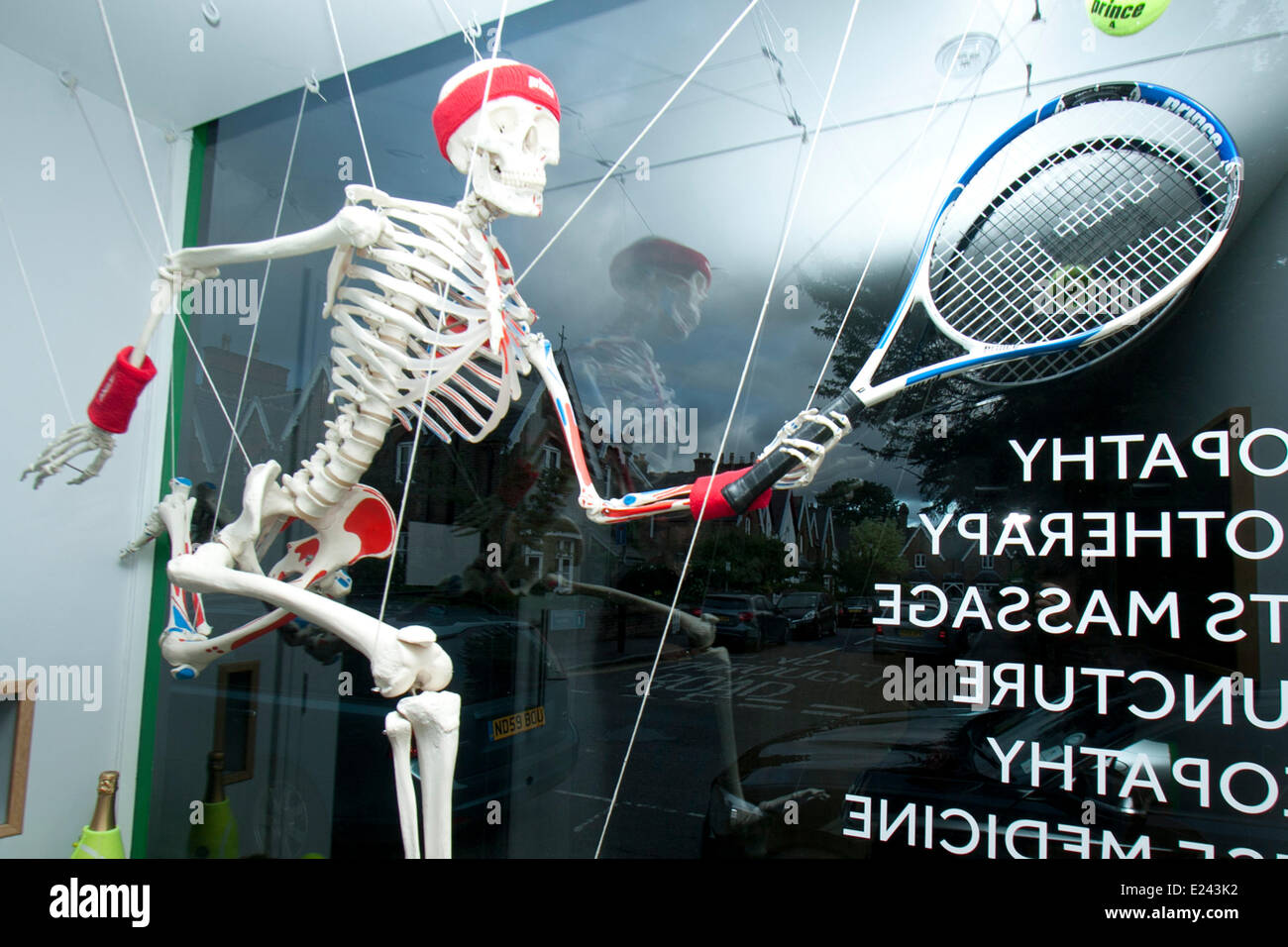 Wimbledon London, UK. 15th June 2014 A human skeleton holding a tennis ...
