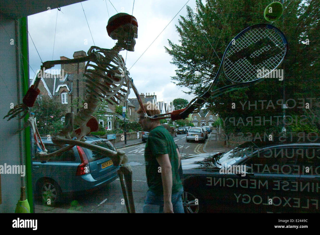 Wimbledon London, UK. 15th June 2014 A human skeleton holding a tennis ...