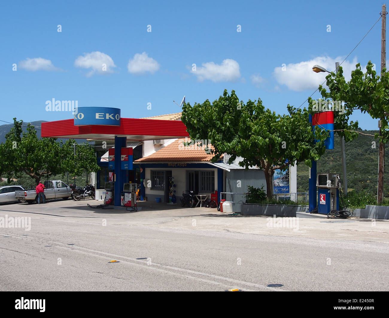 Vehicles at gas station fueling area hi-res stock photography and ...
