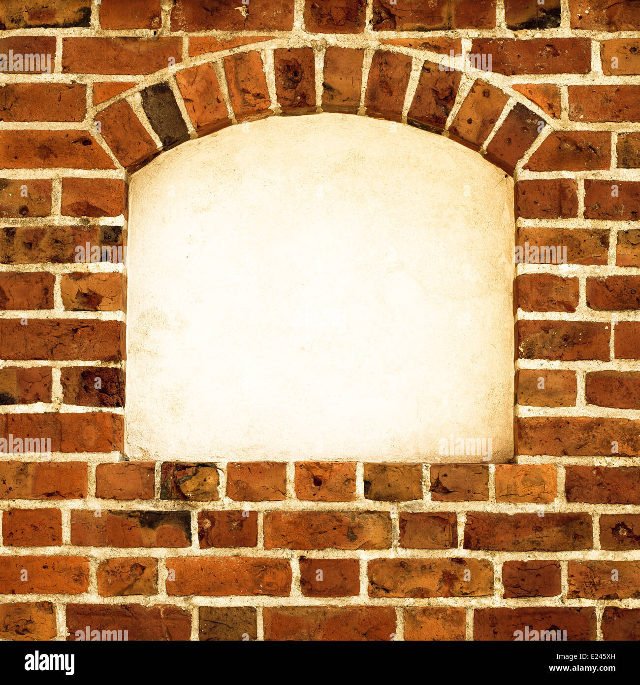 Old stone arch arc niche with space for text frame in brick wall ...