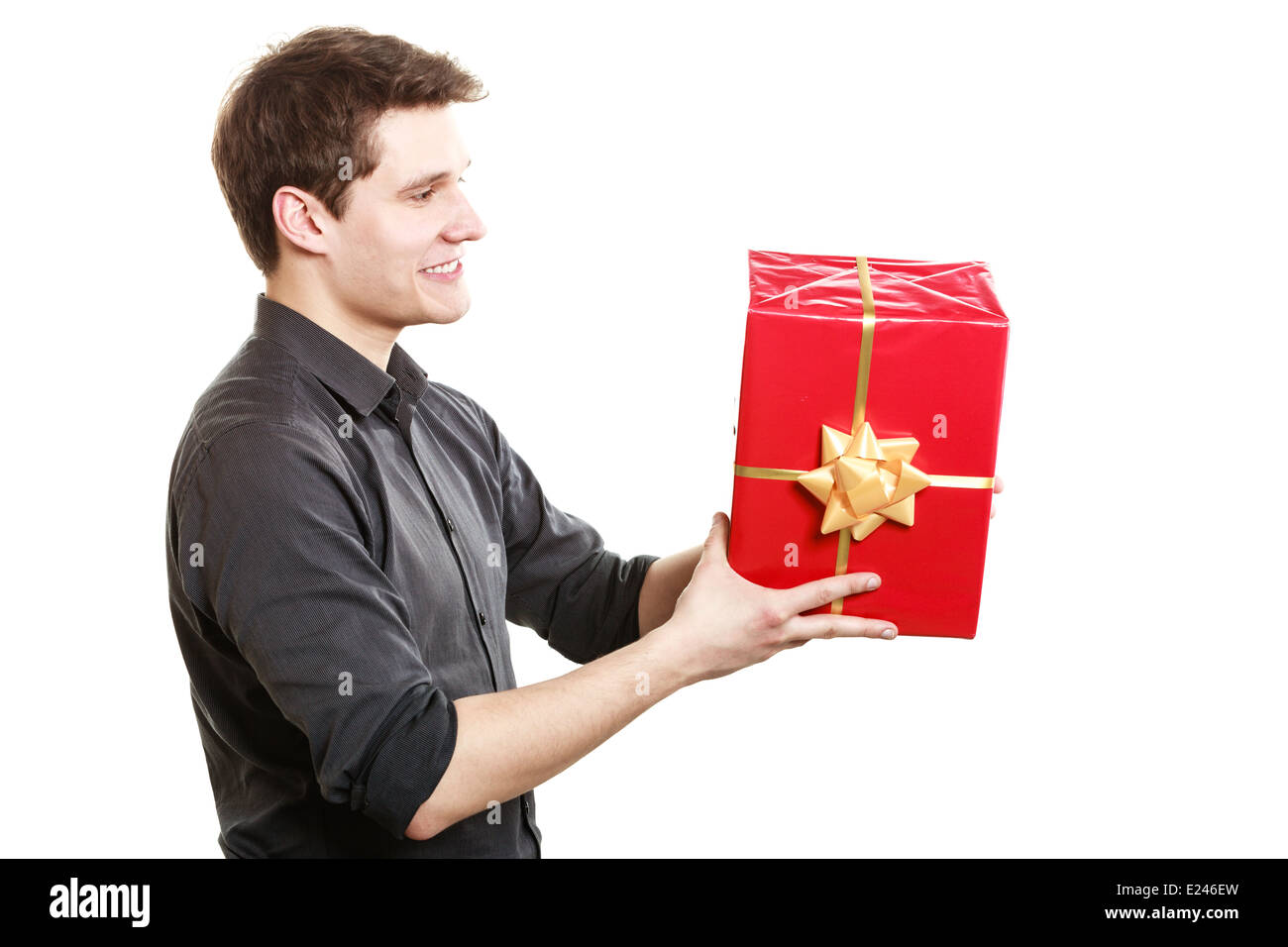 Holiday. Young man giving presents gifts boxes Stock Photo - Alamy