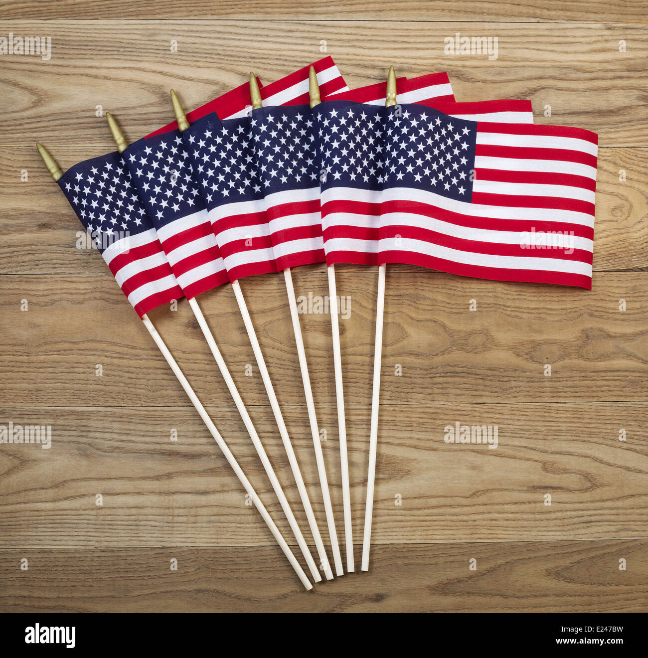Overhead view of United States of America Flags positioned on rustic ...