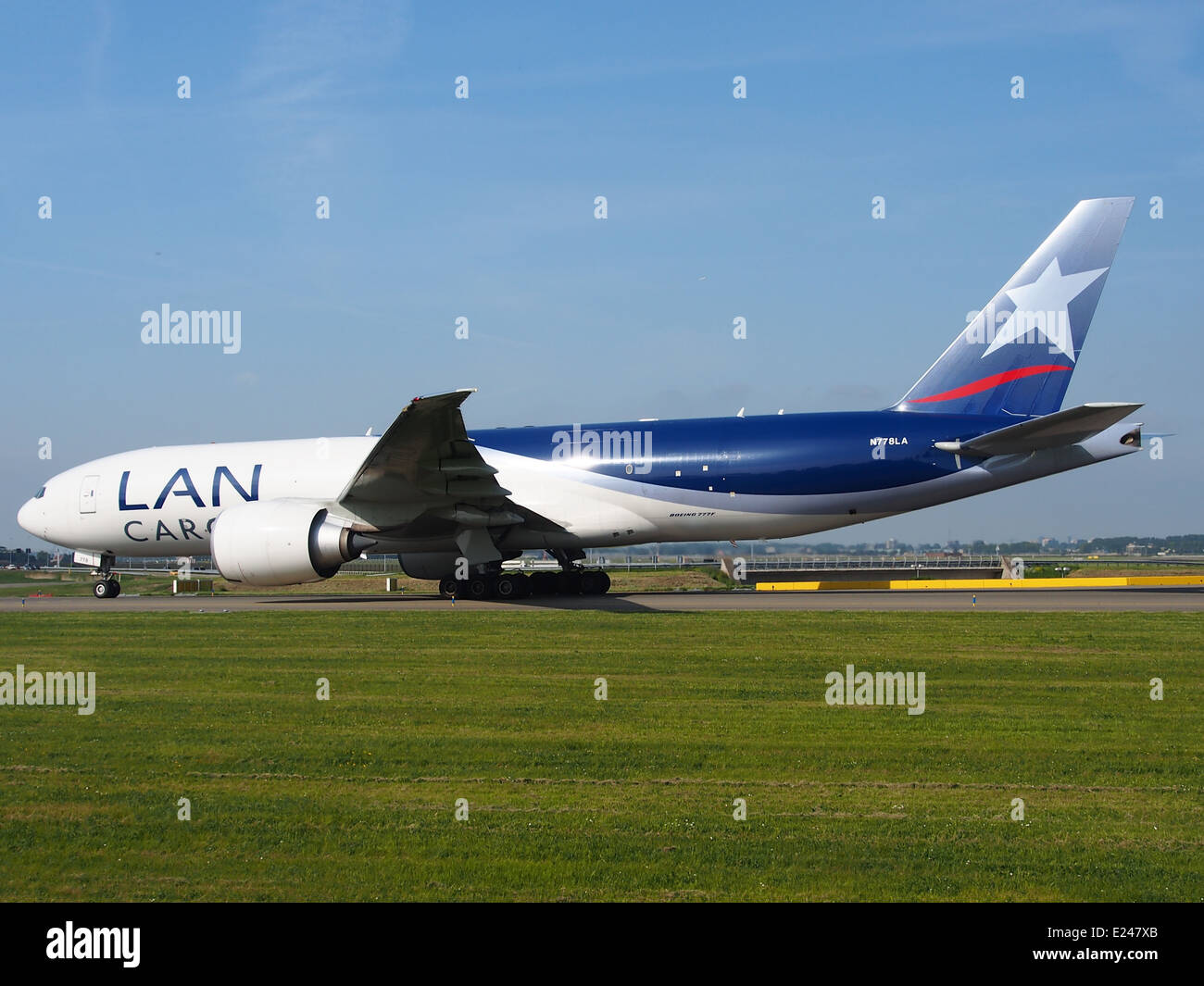 The LAN Cargo Boeing 777F, registered N778LA, taxis on the runway at ...