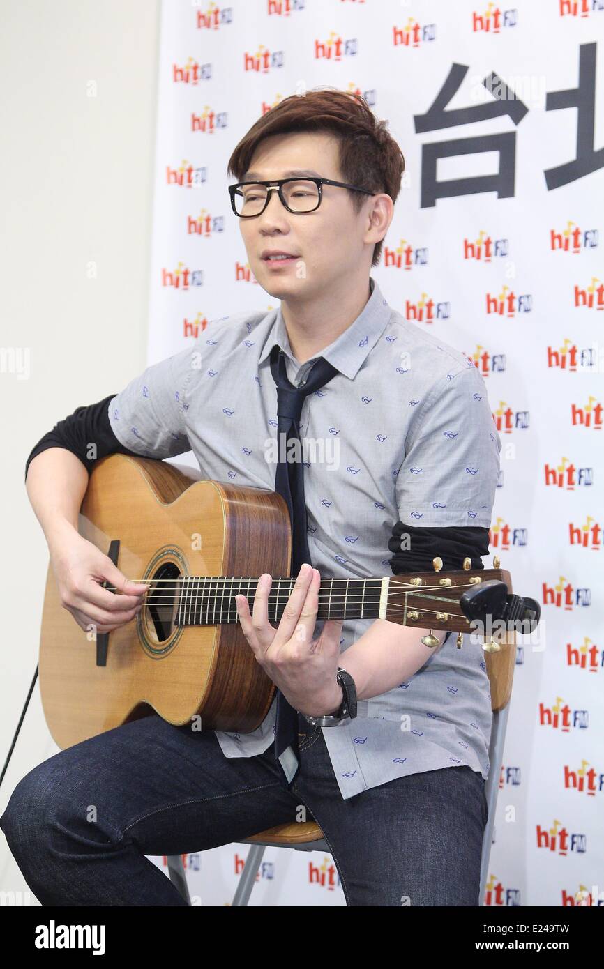 Taipei, China. 12th June, 2014. Singer Victor Wong promotes his new ...