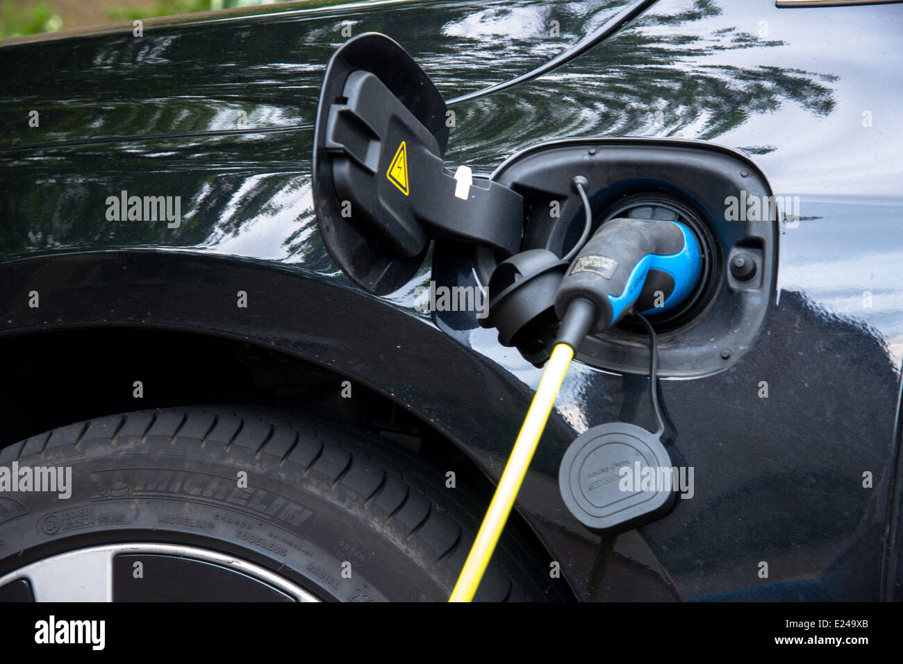 electric car loading energy at a public charging system in the Hague ...