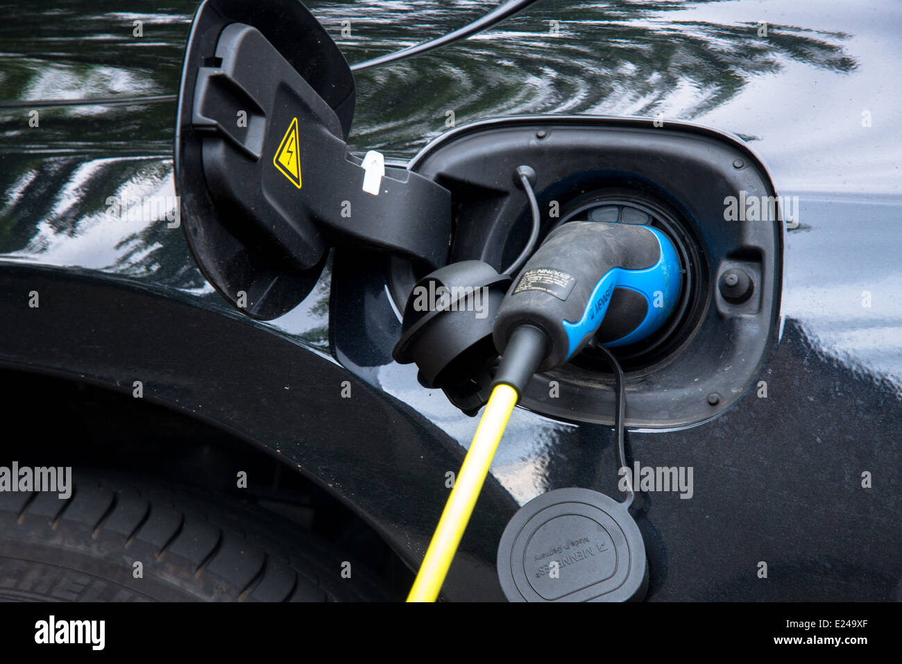 electric car loading energy at a public charging system in the Hague ...