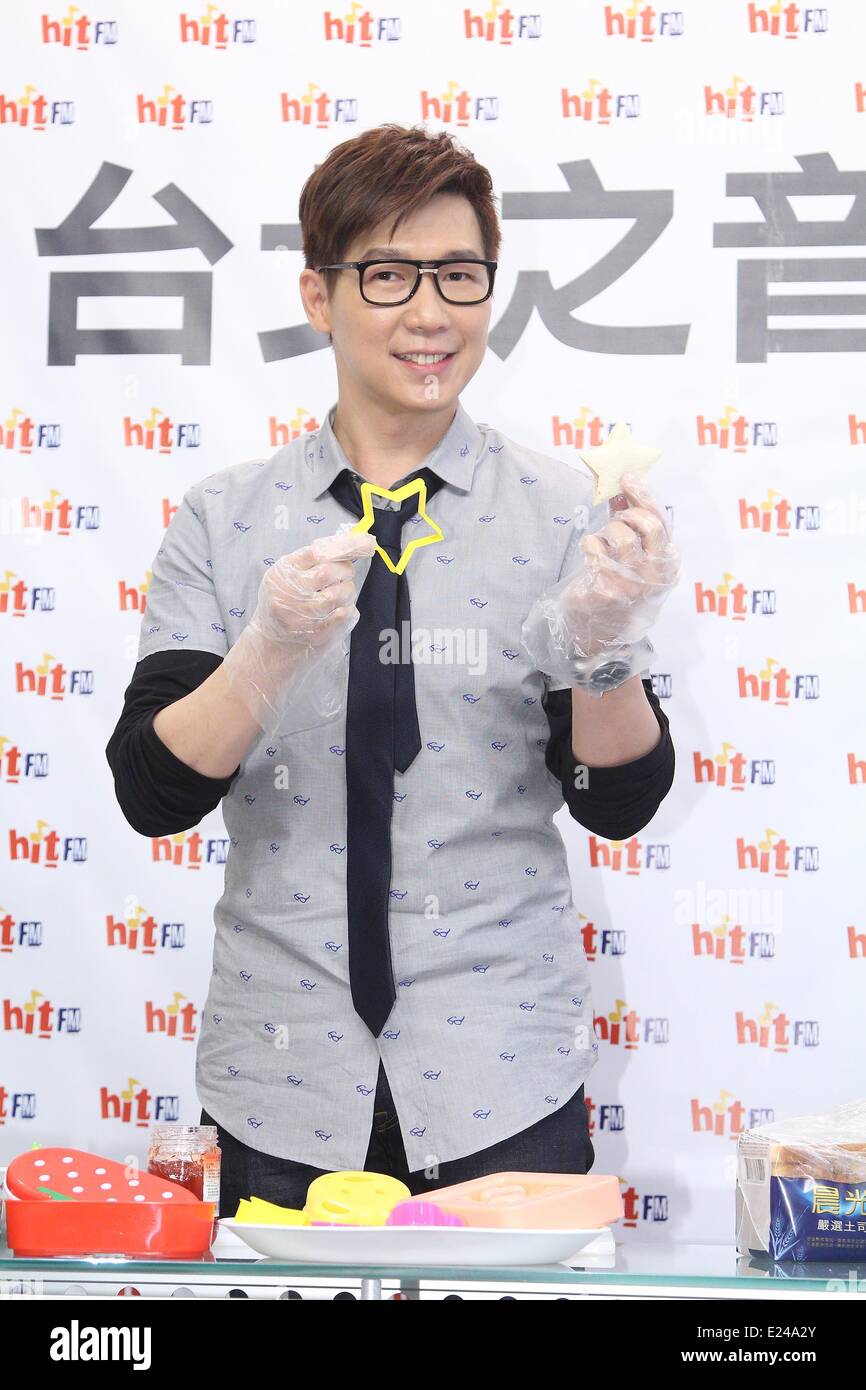 Taipei, China. 12th June, 2014. Singer Victor Wong promotes his new ...