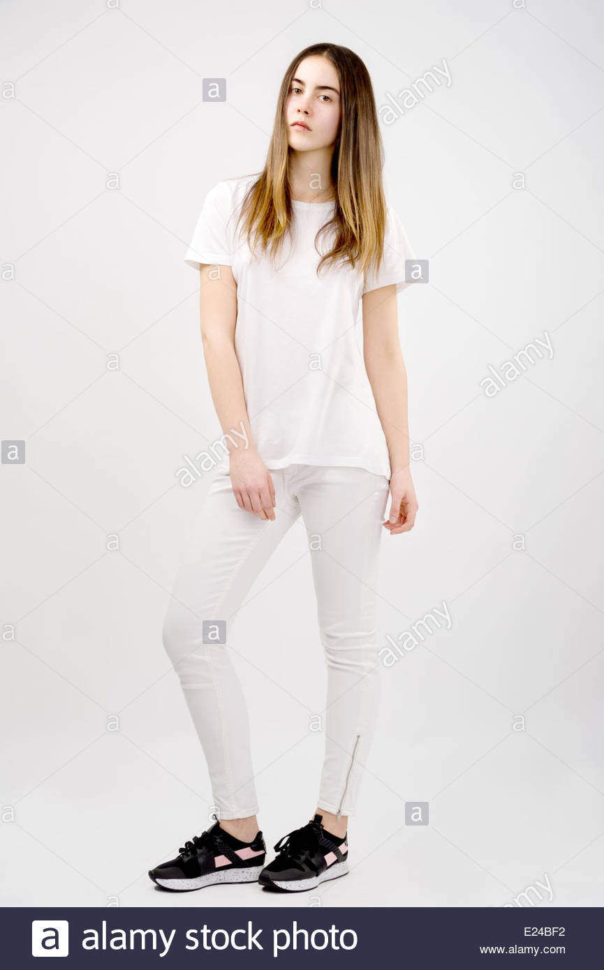 20 years old female fashion model wearing white clothes against white ...