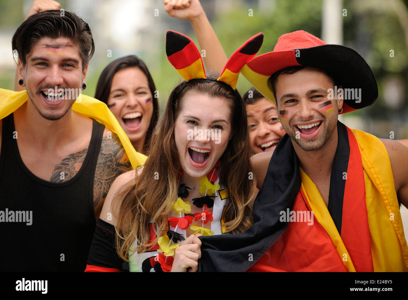 Happy group of German sport soccer fans celebrating victory together 2 ...