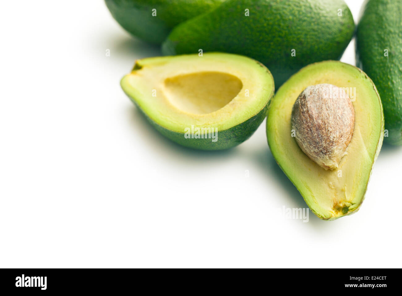 halved avocados on white background Stock Photo - Alamy