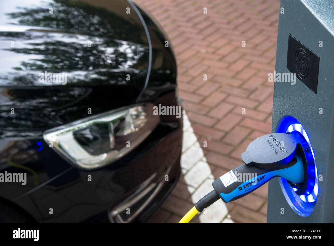 electric car loading energy at a public charging system in the Hague ...