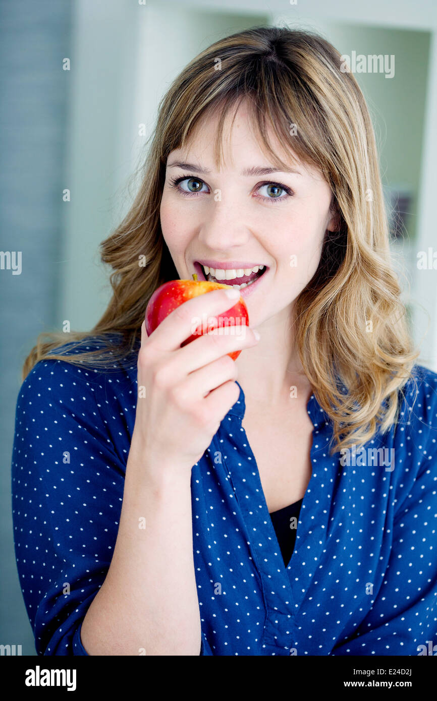 Woman eating fruit Stock Photo - Alamy
